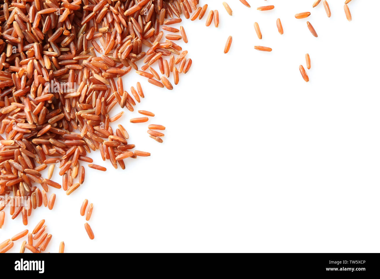 Red rice on white background Stock Photo - Alamy