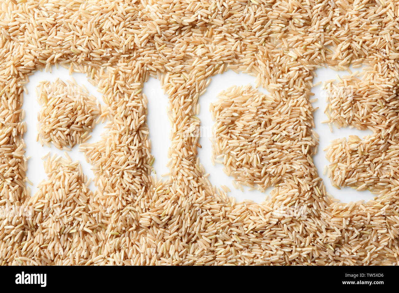 Composition with word Rice on white background Stock Photo - Alamy
