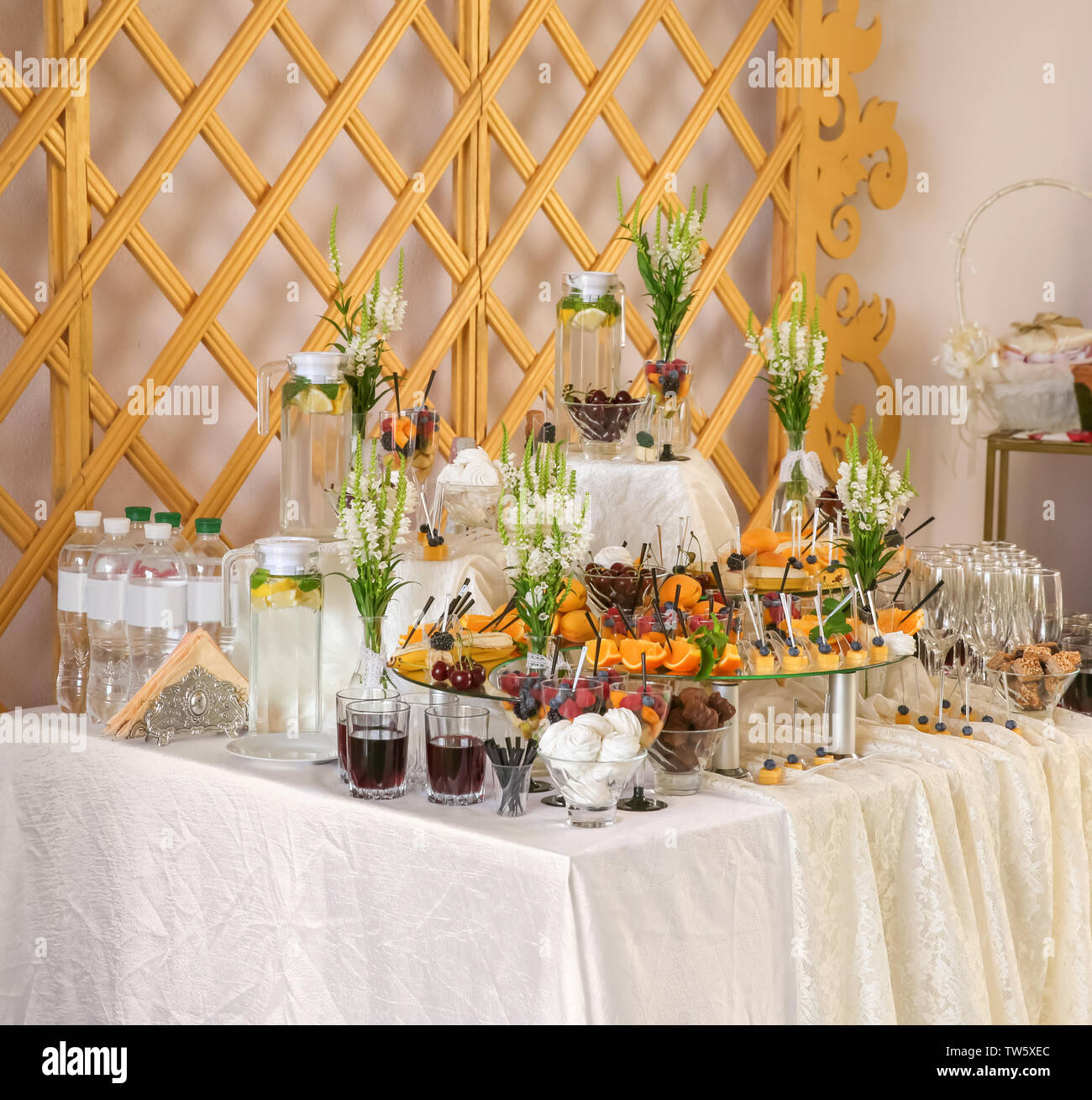 Wedding buffet table with different fruit desserts and drinks indoors ...