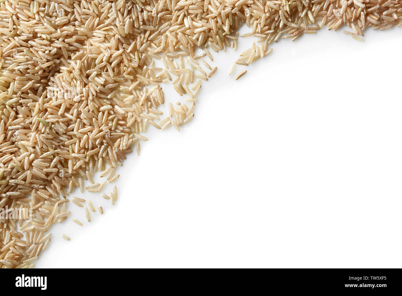 Brown rice on white background Stock Photo - Alamy