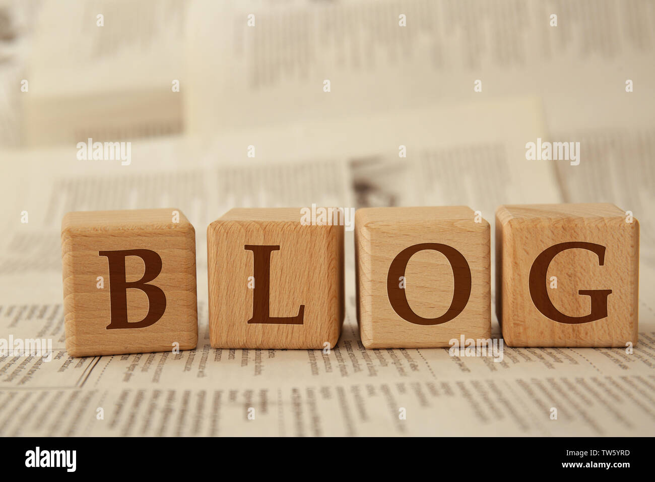 Wooden cubes with word BLOG on paper background Stock Photo - Alamy