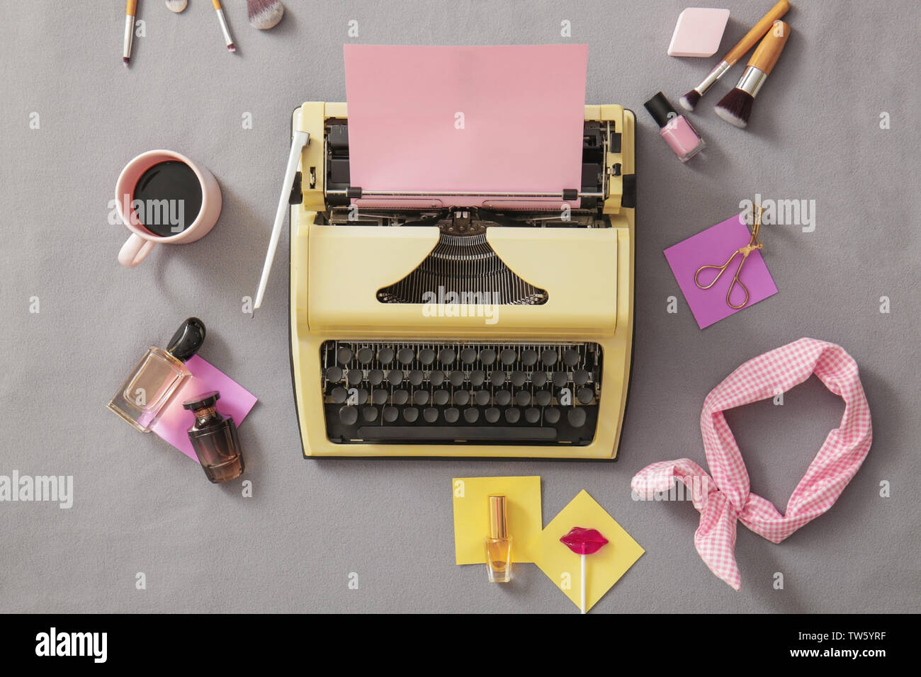 Composition with retro typewriter on grey background. Beauty blogger ...