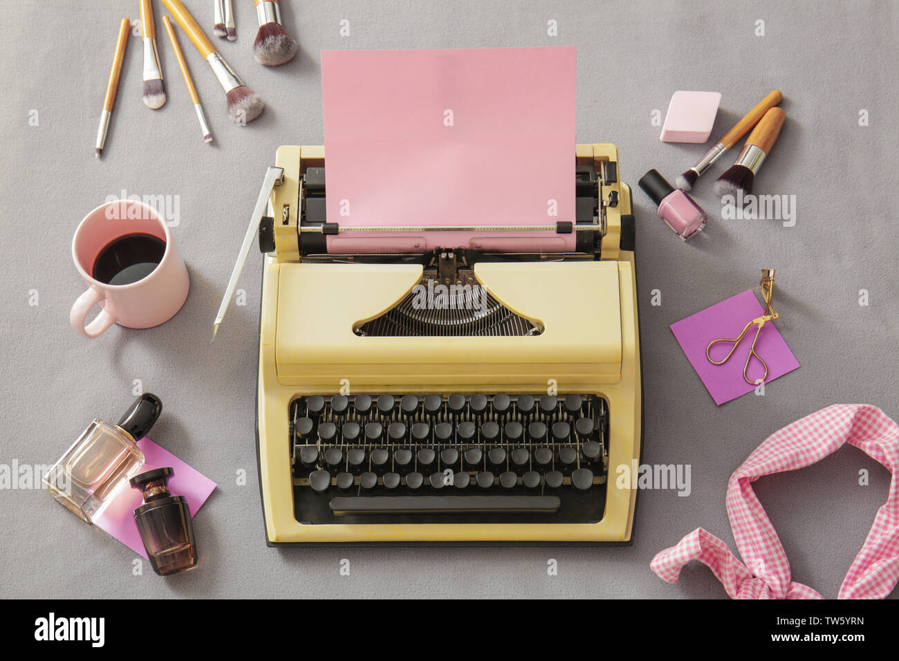 Composition with retro typewriter on grey background. Beauty blogger ...