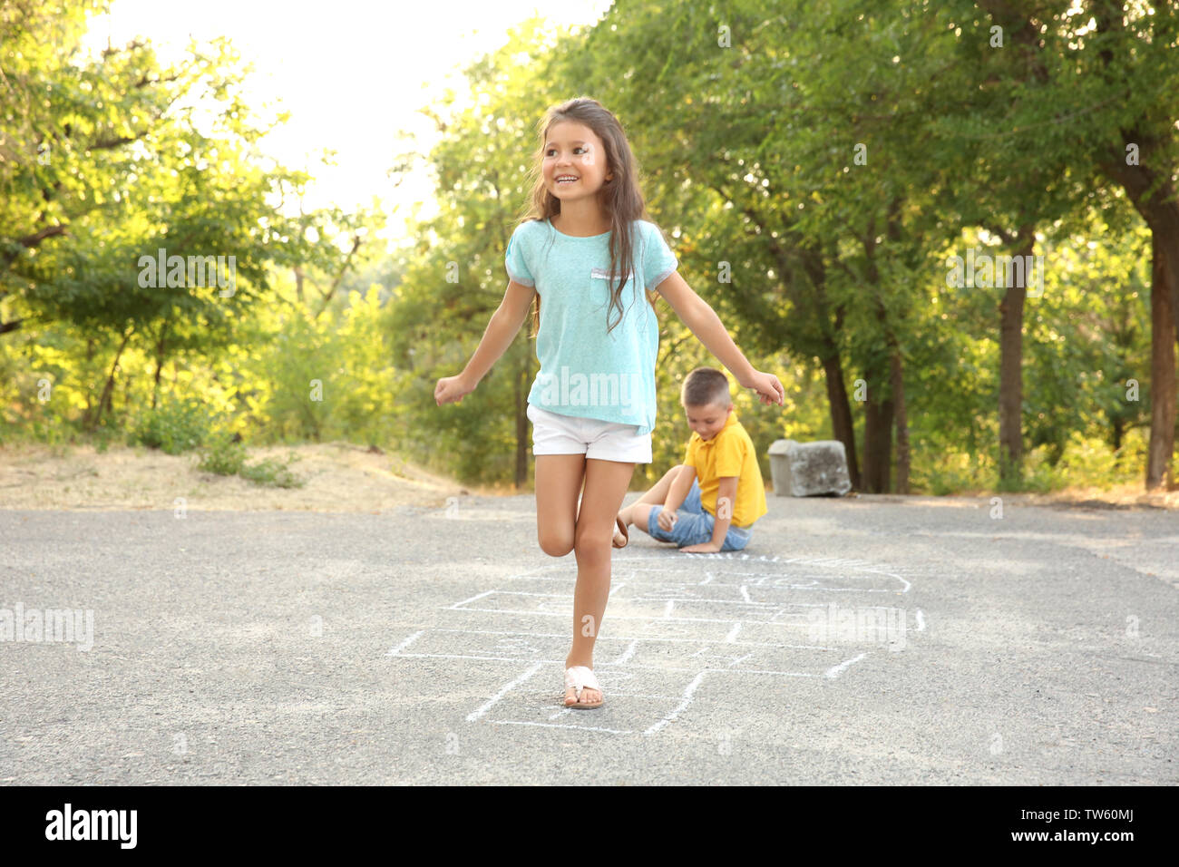 Kids playing hopscotch hi-res stock photography and images - Alamy