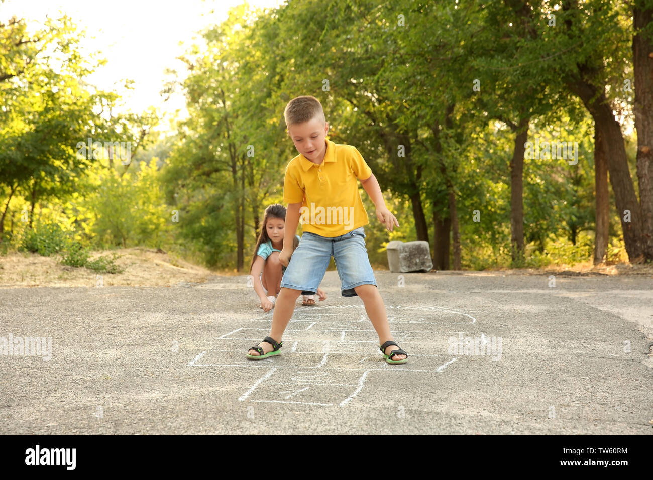 Kids playing hopscotch hi-res stock photography and images - Alamy