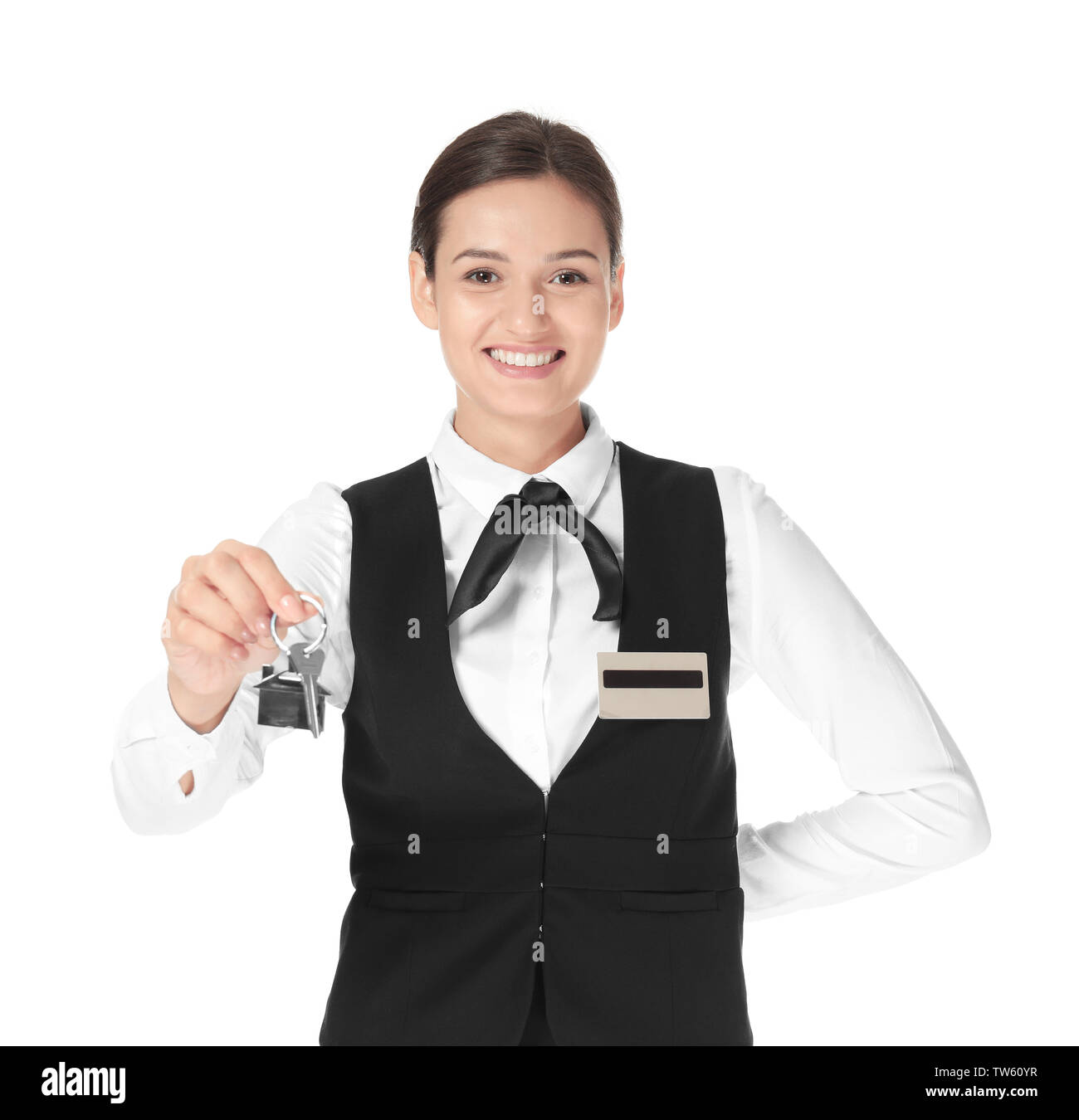 Female hotel receptionist with room key on white background Stock Photo ...