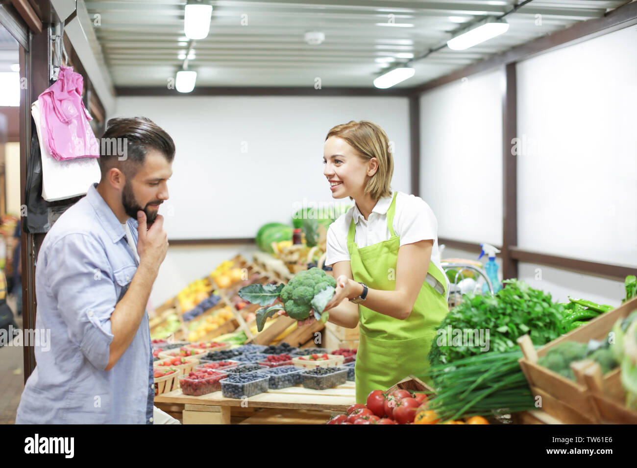 Male sales assistant helping female hi-res stock photography and images ...