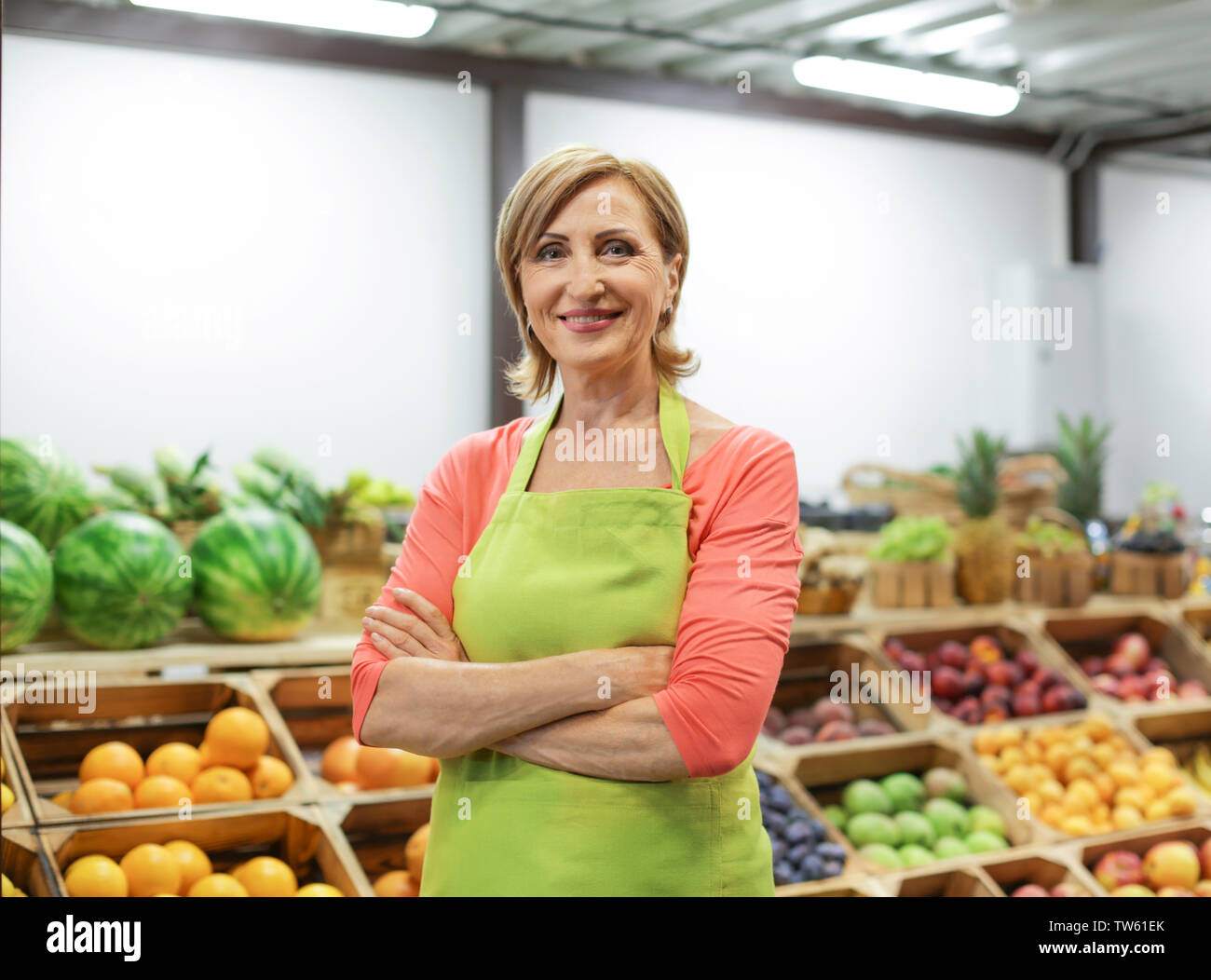 Mature woman shop assistant hi-res stock photography and images - Alamy