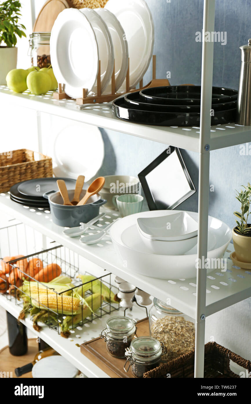Tableware on storage stand indoors Stock Photo - Alamy