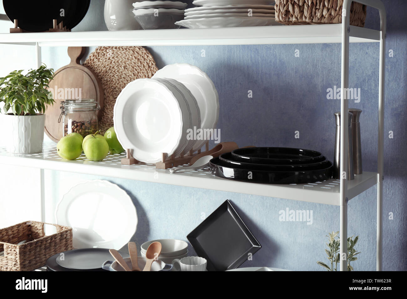 Tableware on storage stand indoors Stock Photo - Alamy