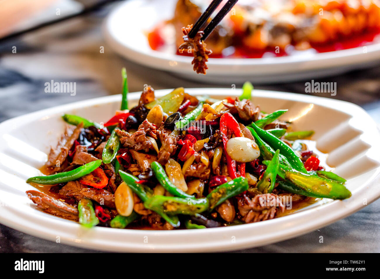 Delicious Chinese food on table Stock Photo - Alamy