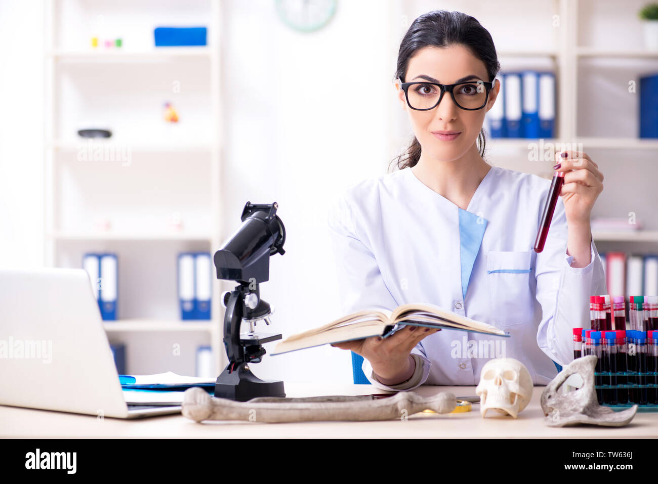 Young female archaeologist working in the lab Stock Photo - Alamy