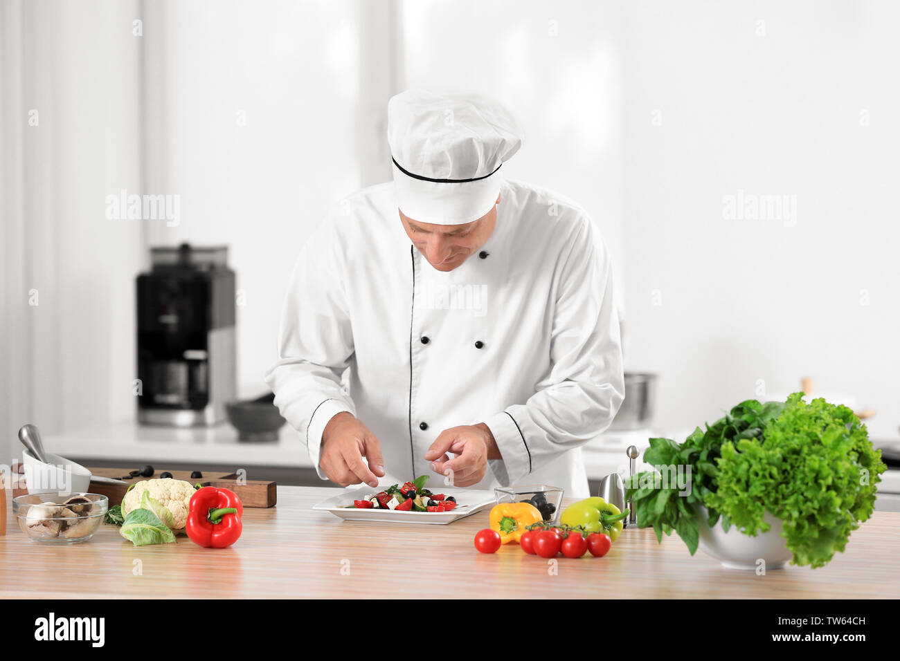 Male chef cooking in kitchen Stock Photo - Alamy