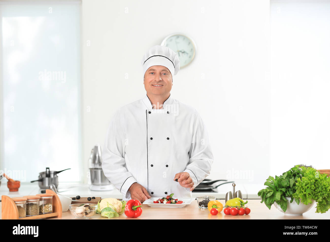 Male chef cooking in kitchen Stock Photo - Alamy