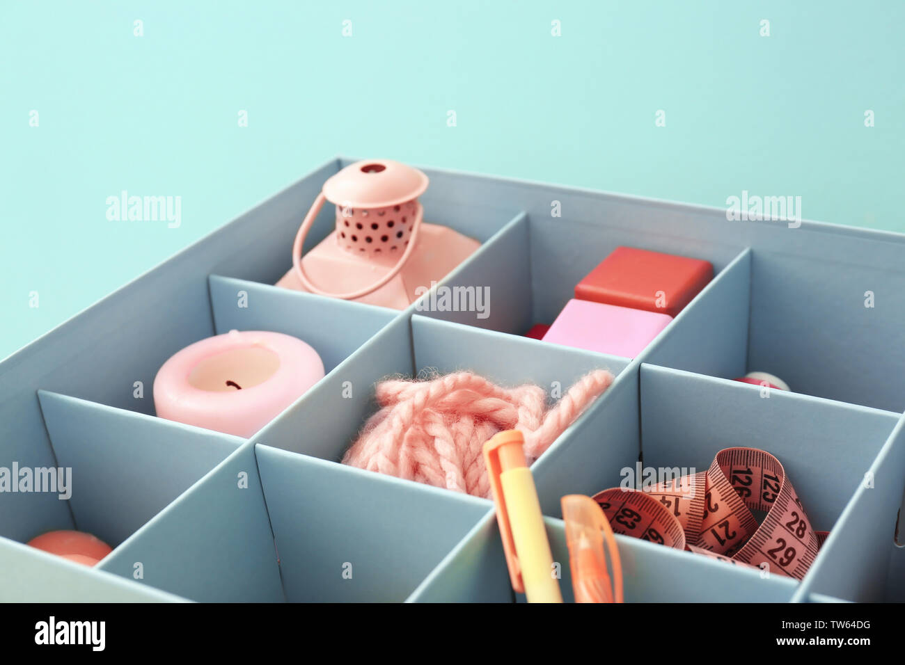 Box with pink accessories on trendy color background Stock Photo - Alamy