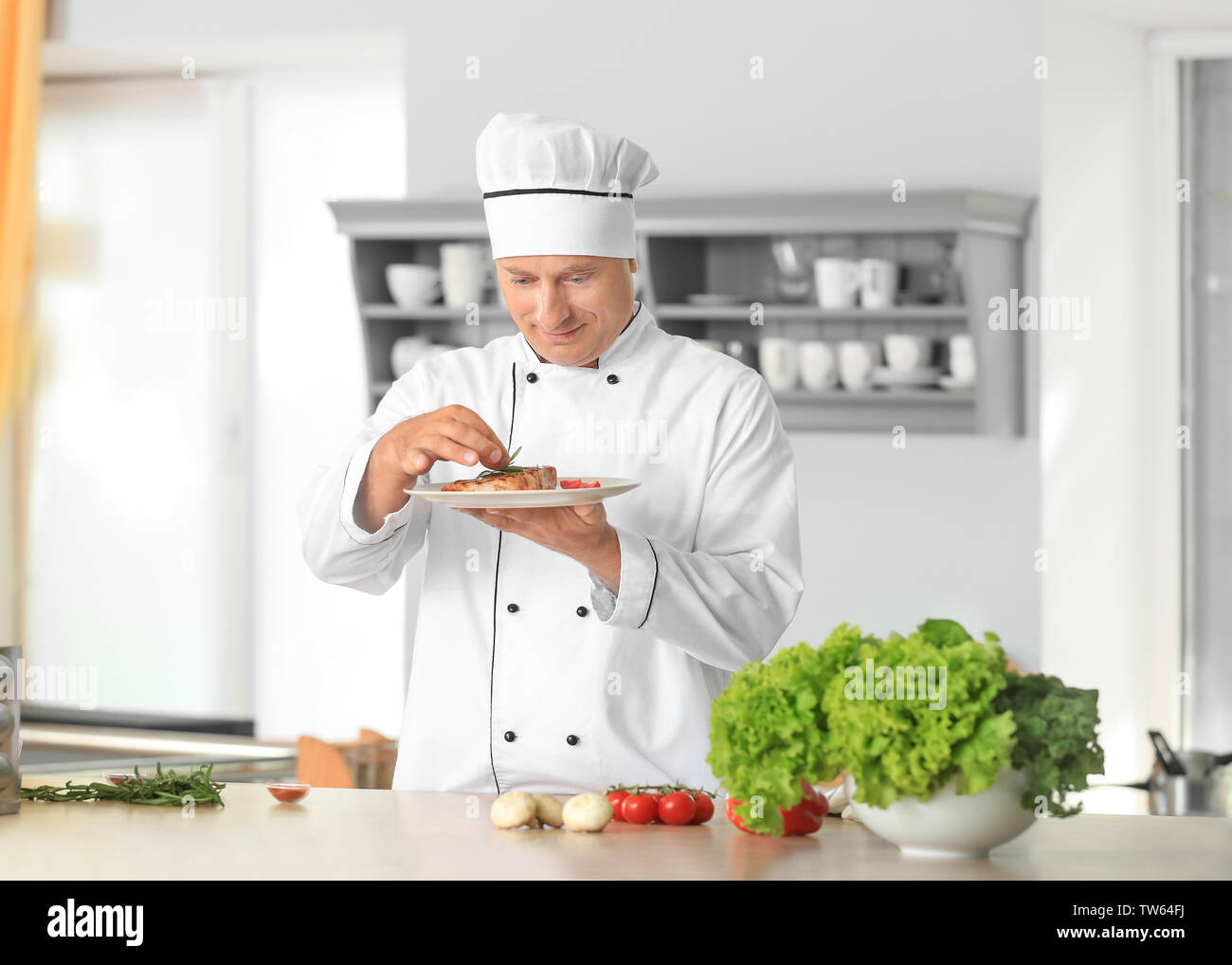 Male chef cooking meat hi-res stock photography and images - Alamy