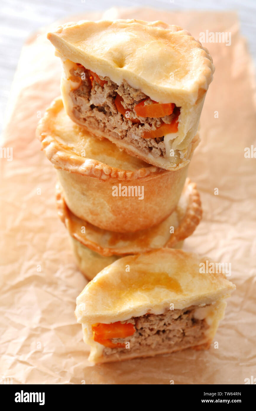 Delicious little meat pies on table Stock Photo - Alamy