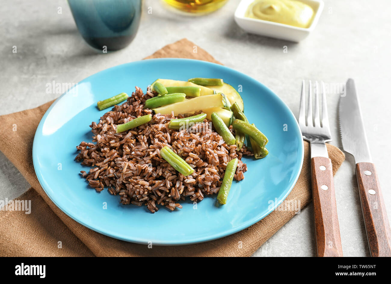 Red rice with vegetables on plate Stock Photo - Alamy