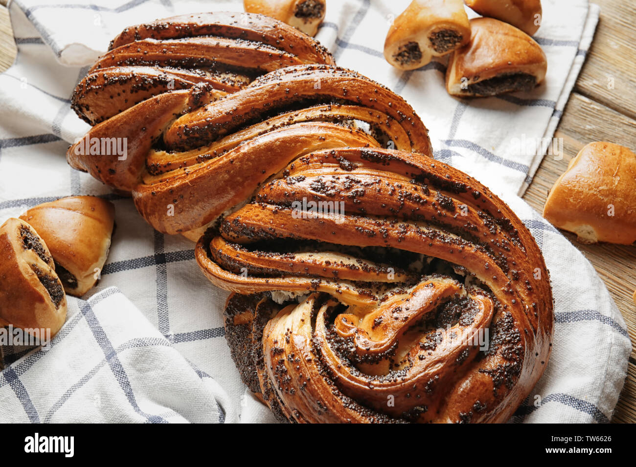 Tasty pastries with poppy seeds on table Stock Photo - Alamy
