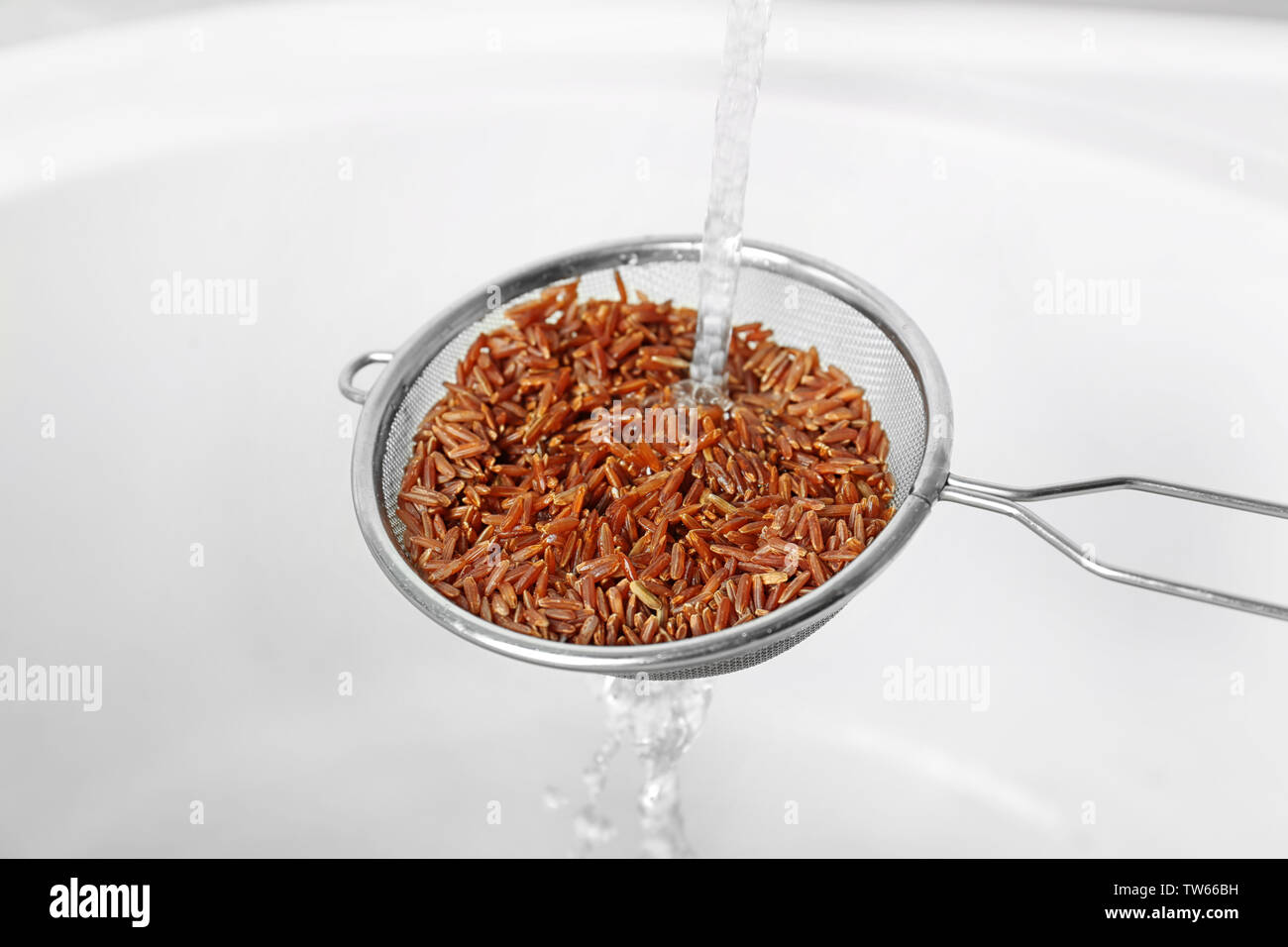 Washing of rice hi-res stock photography and images - Alamy