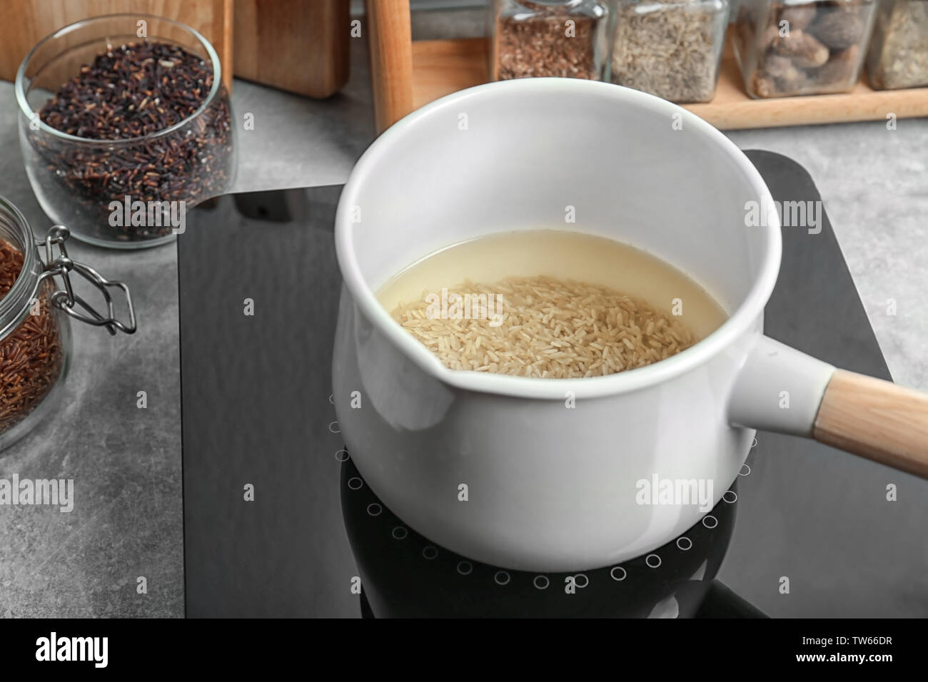 Rice boiling in saucepan hi-res stock photography and images - Alamy