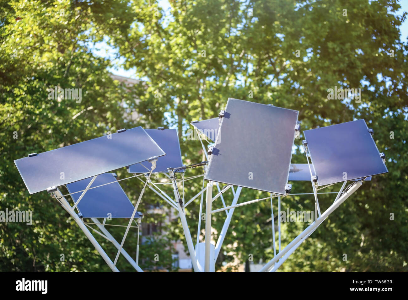 Solar panel tree on city street Stock Photo - Alamy