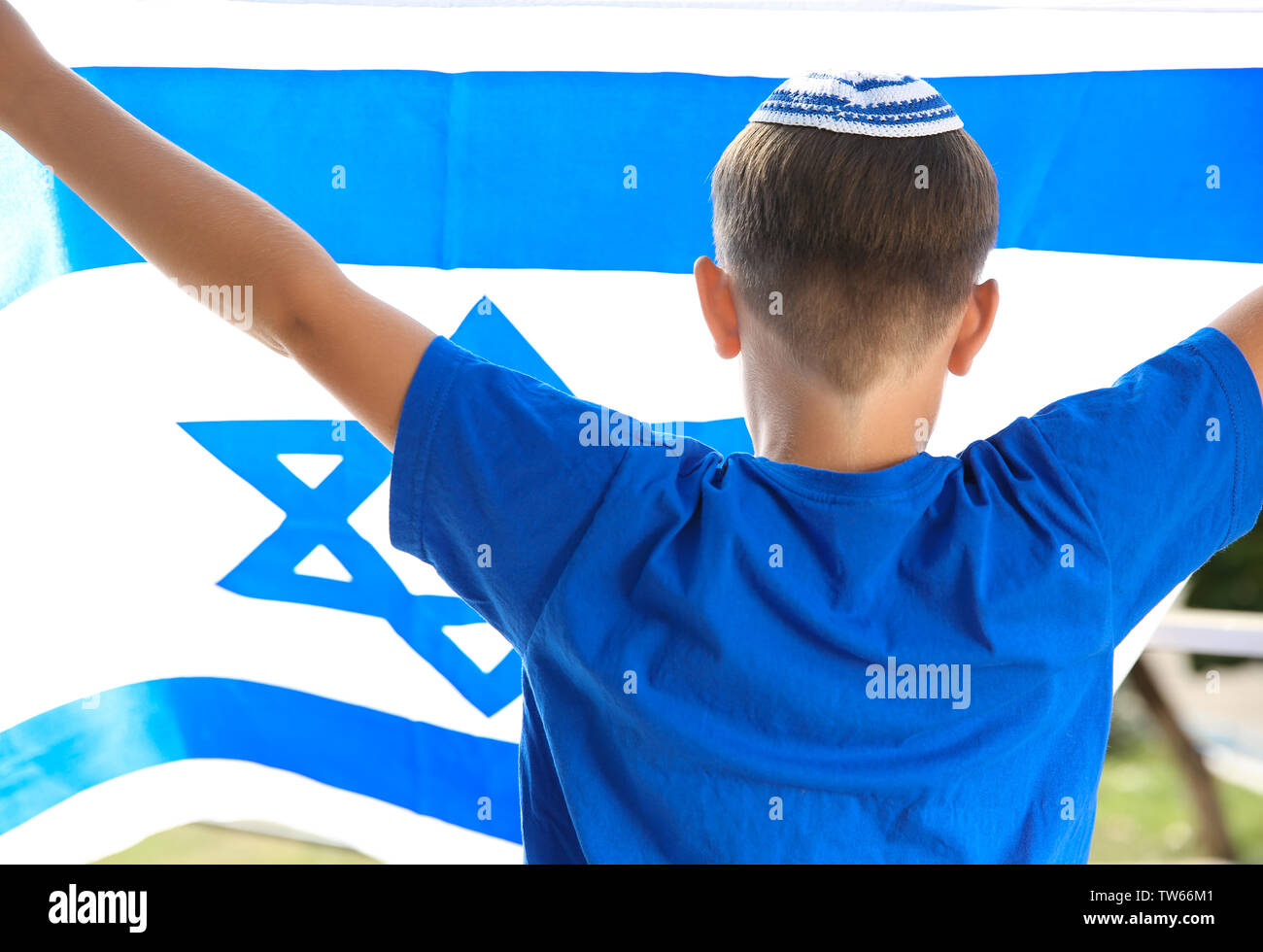 Cute boy with big flag of Israel outdoors Stock Photo - Alamy