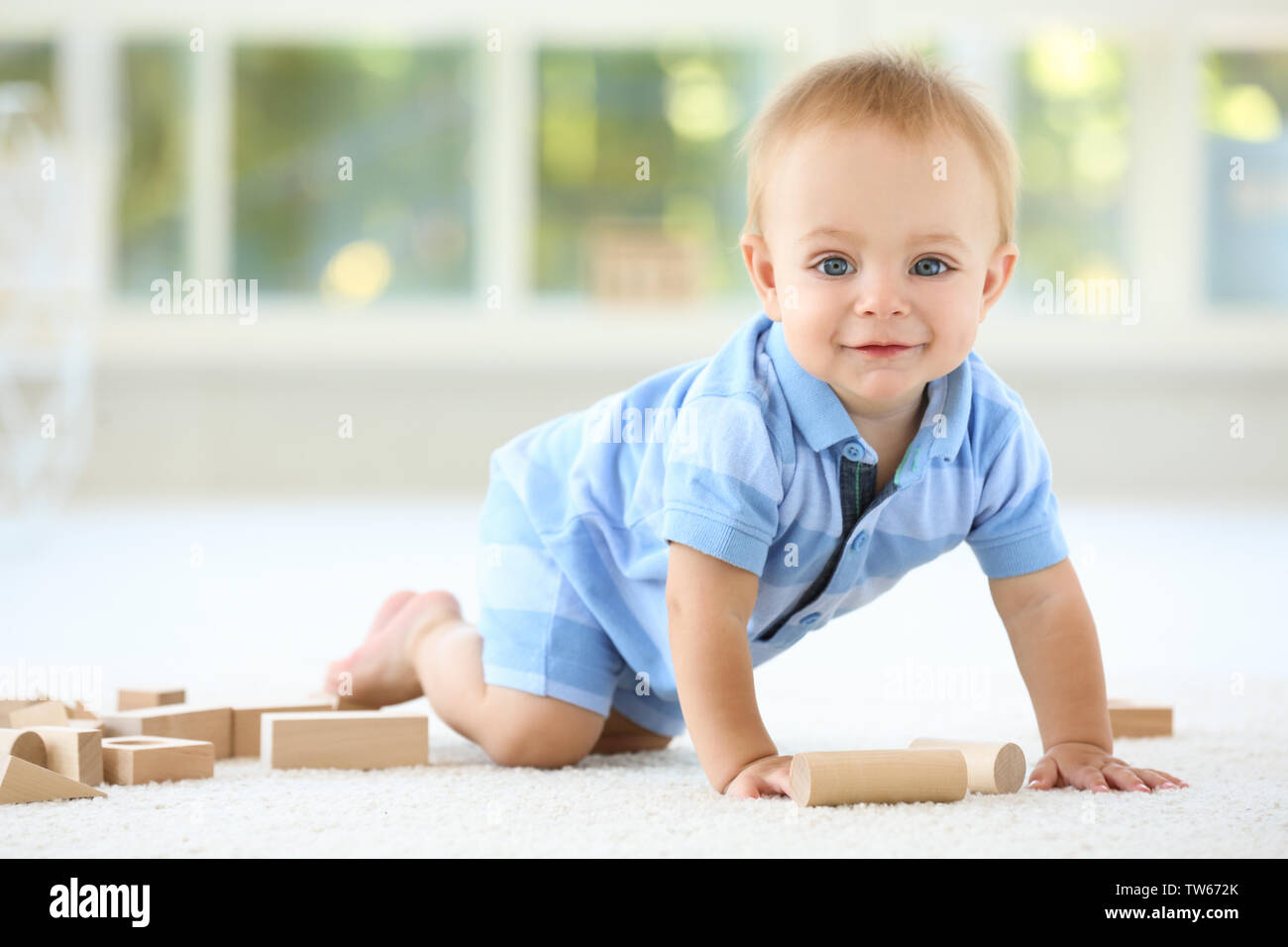 Cute little baby playing at home Stock Photo - Alamy