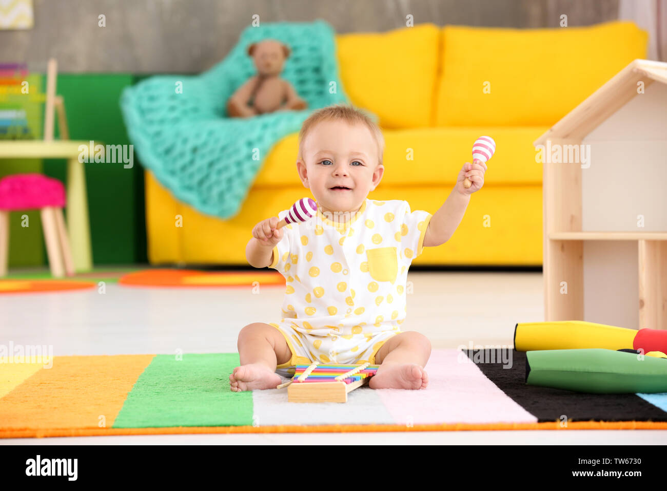 Baby playing musical instruments hi-res stock photography and images ...