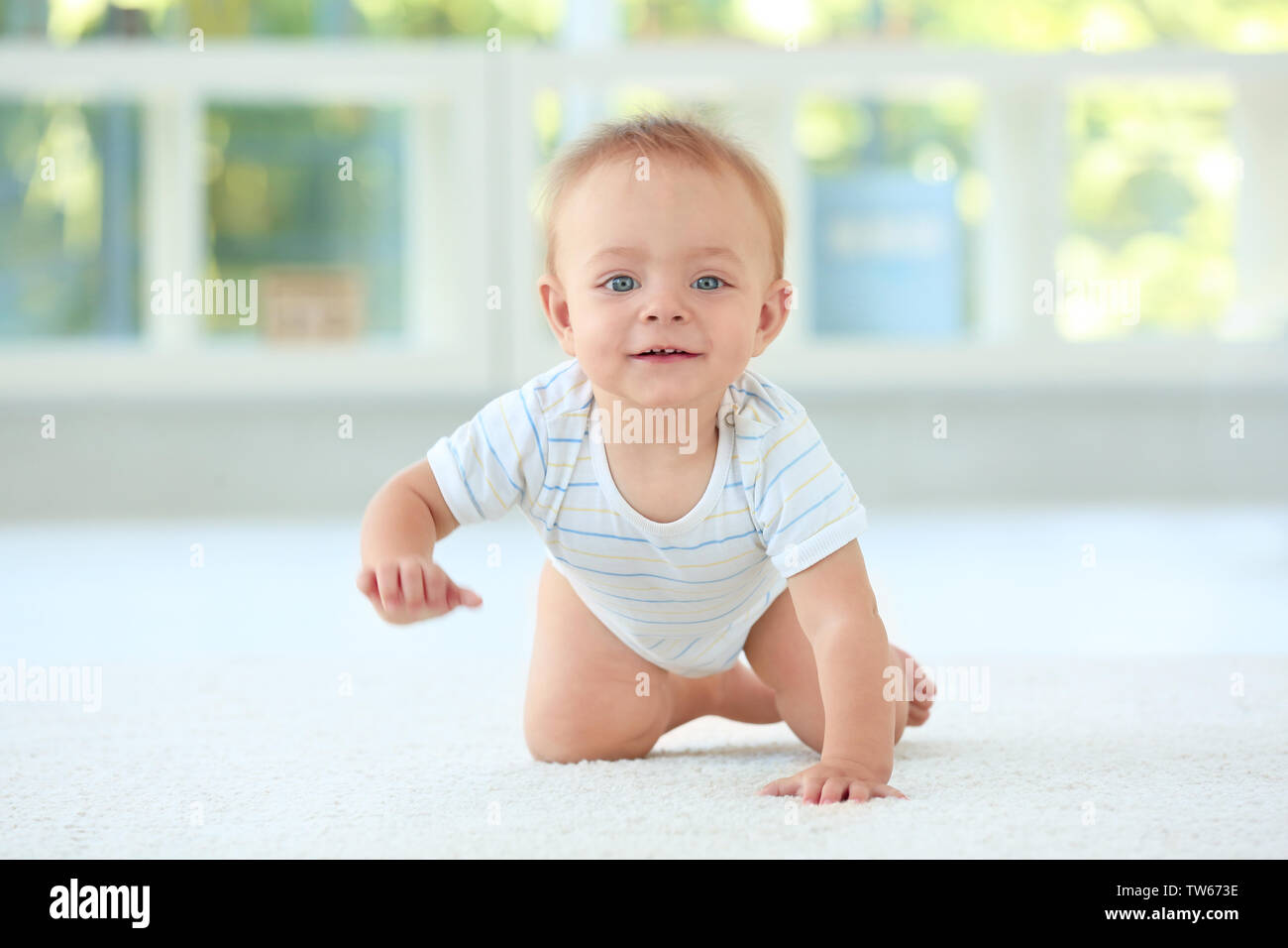 Cute little baby at home Stock Photo - Alamy