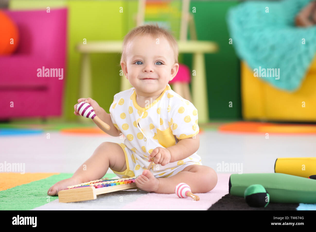 Baby playing musical instruments hi-res stock photography and images ...