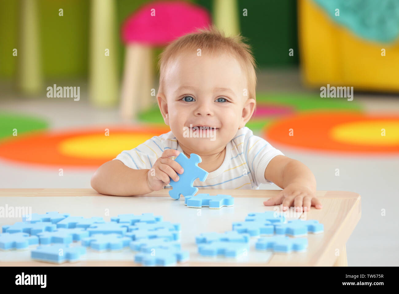 Cute little baby playing at home Stock Photo - Alamy