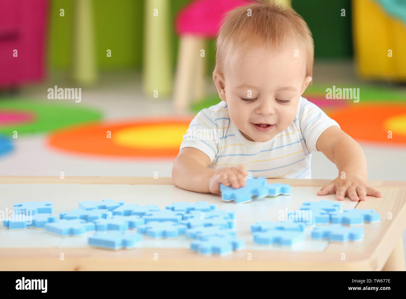 Cute little baby playing at home Stock Photo - Alamy