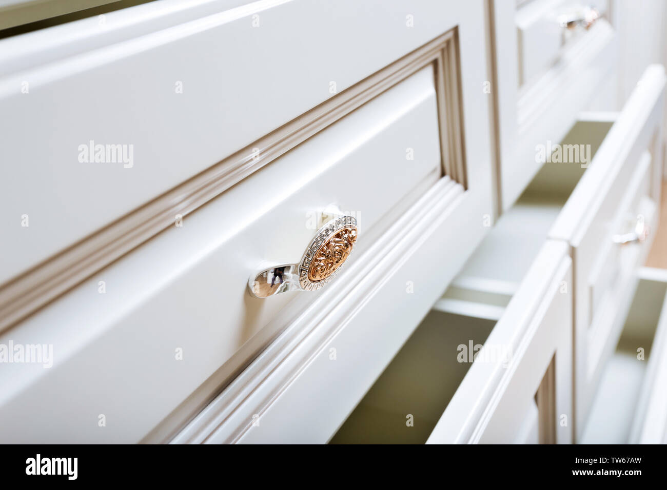 beautiful cabinet with drawers in a modern room Stock Photo - Alamy