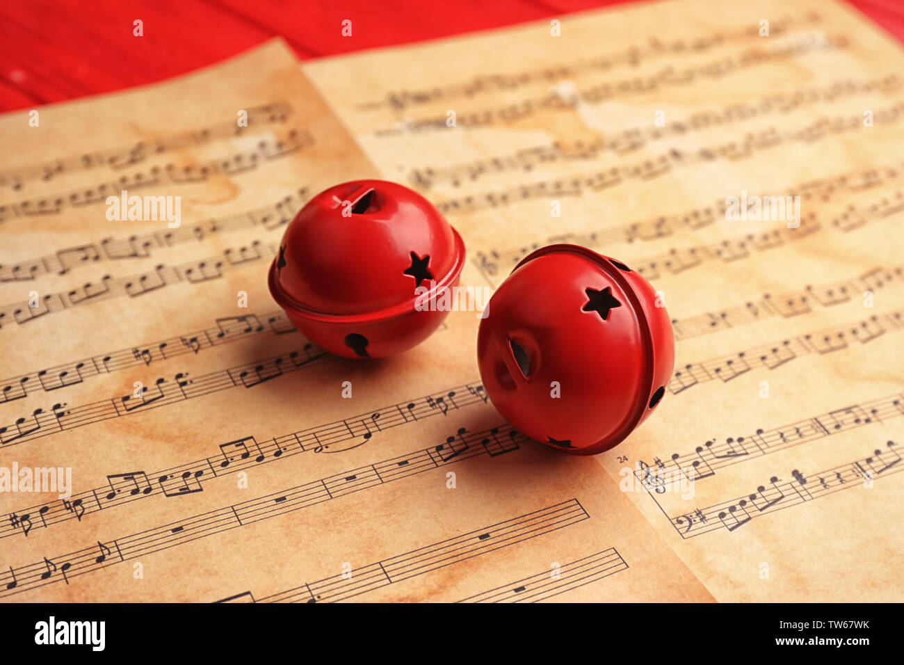 Decorative bells on music sheets. Christmas songs concept Stock Photo ...