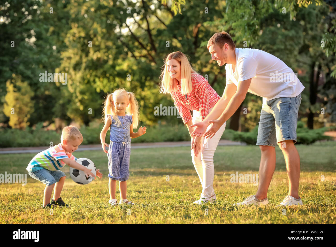 Father kids playing football together hi-res stock photography and ...