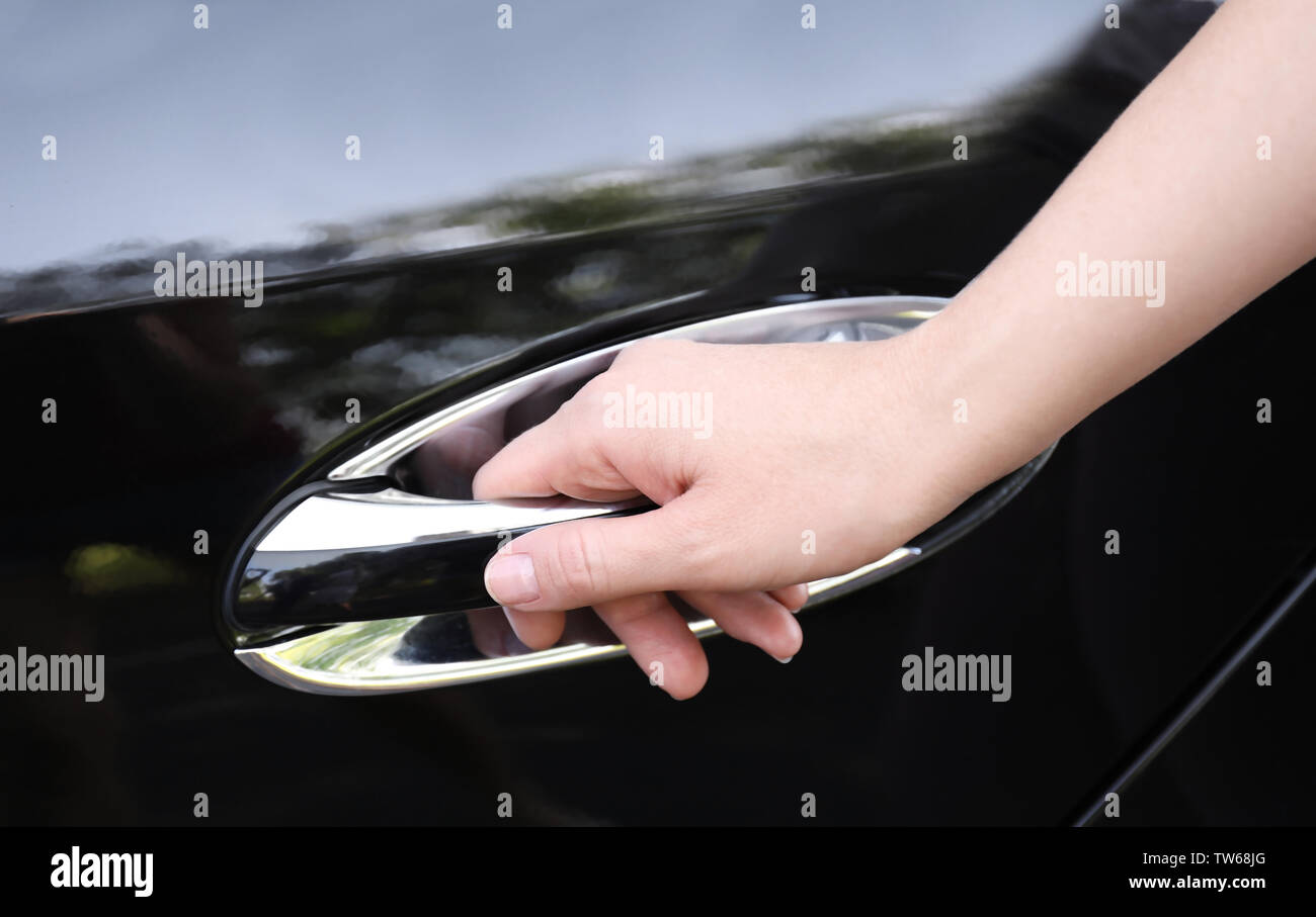 Woman opening car door hi-res stock photography and images - Alamy