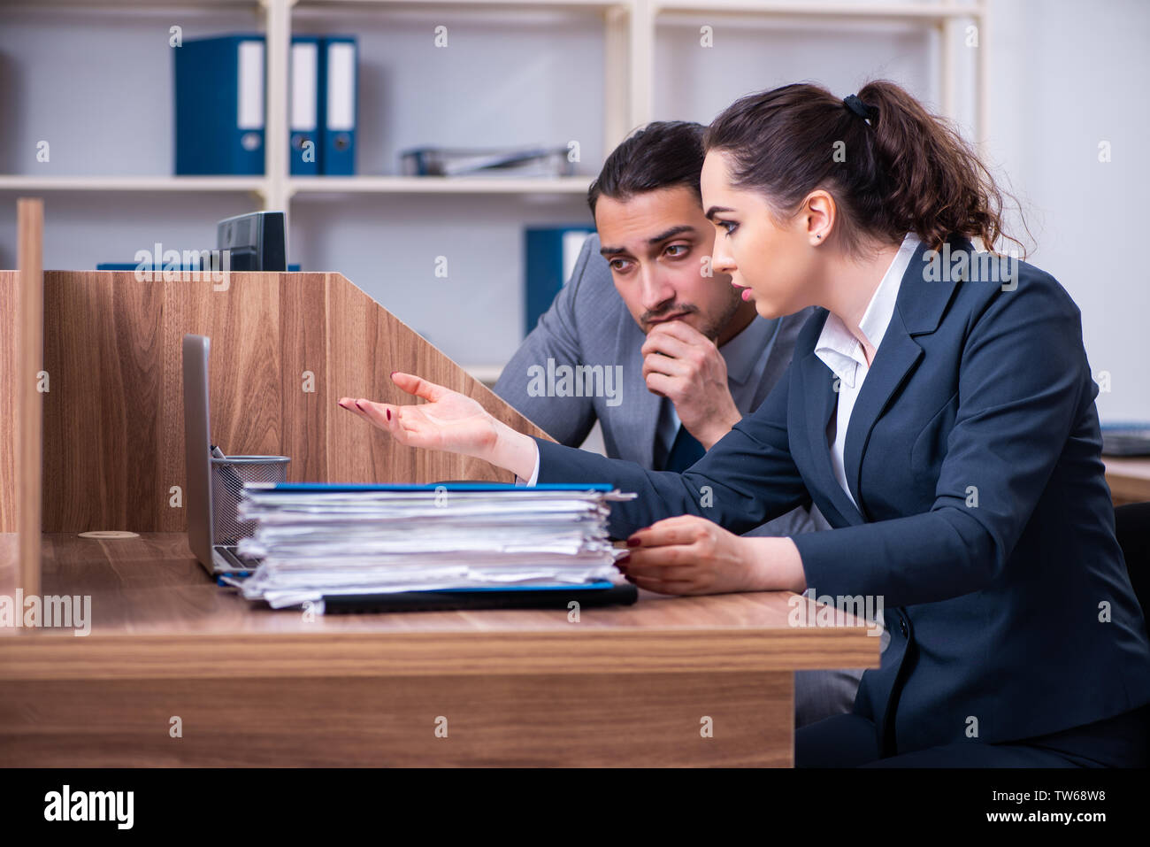 Two employees working in the office Stock Photo - Alamy