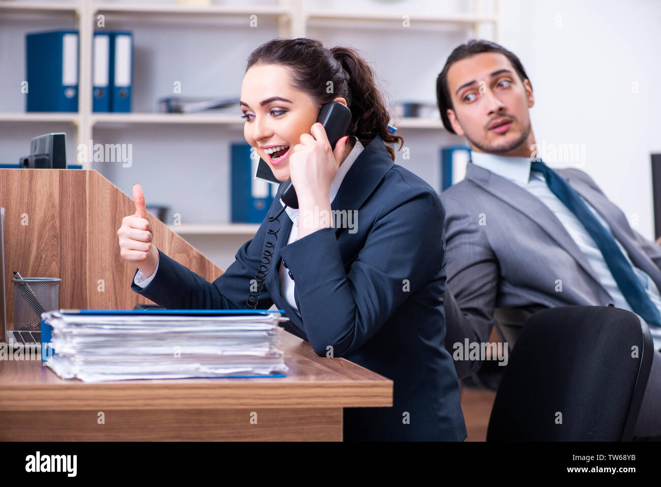 Two employees working in the office Stock Photo - Alamy