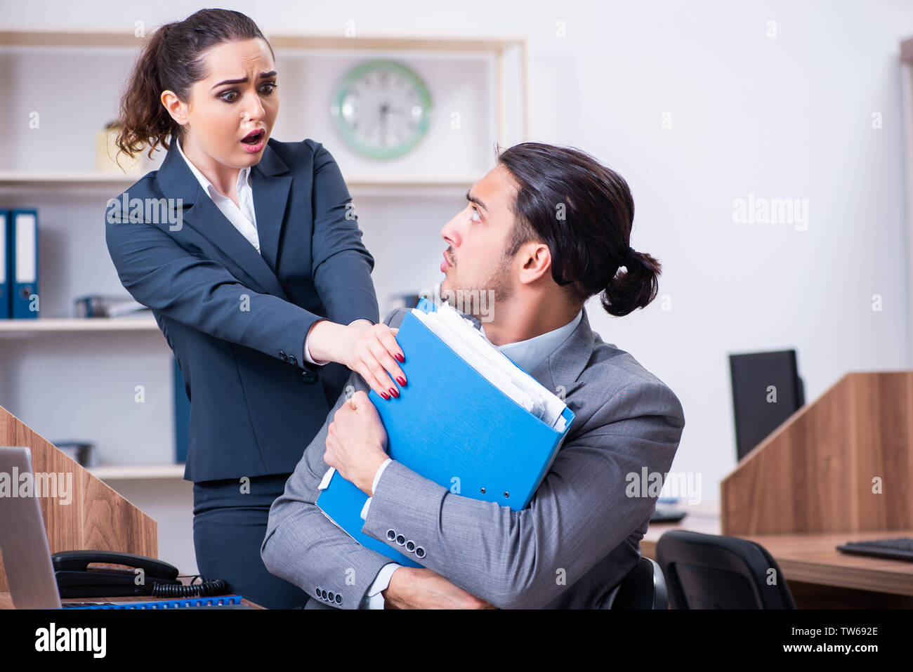 Two employees working in the office Stock Photo - Alamy