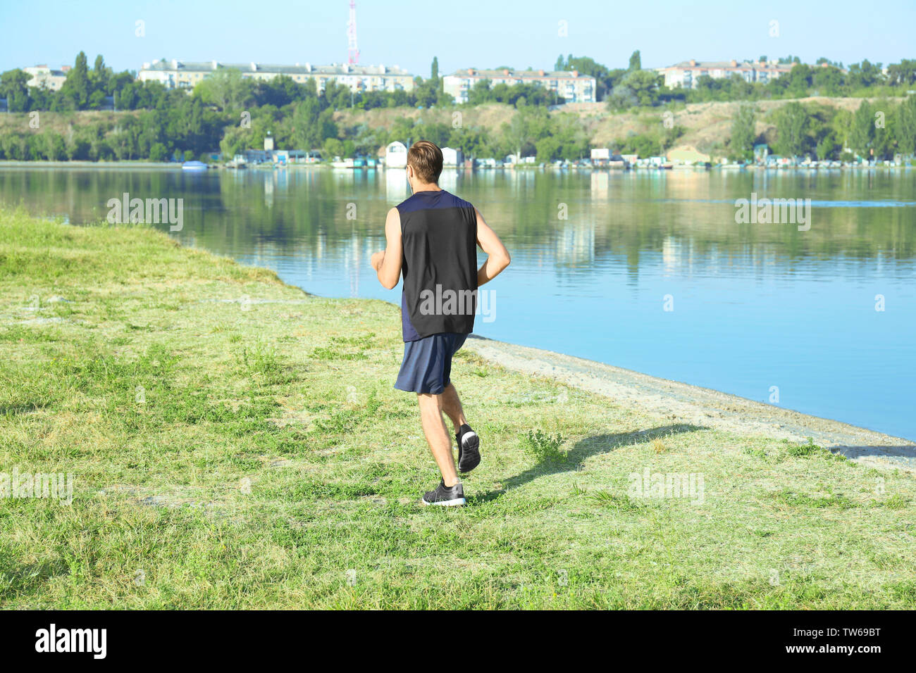 Handsome young man running hi-res stock photography and images - Alamy