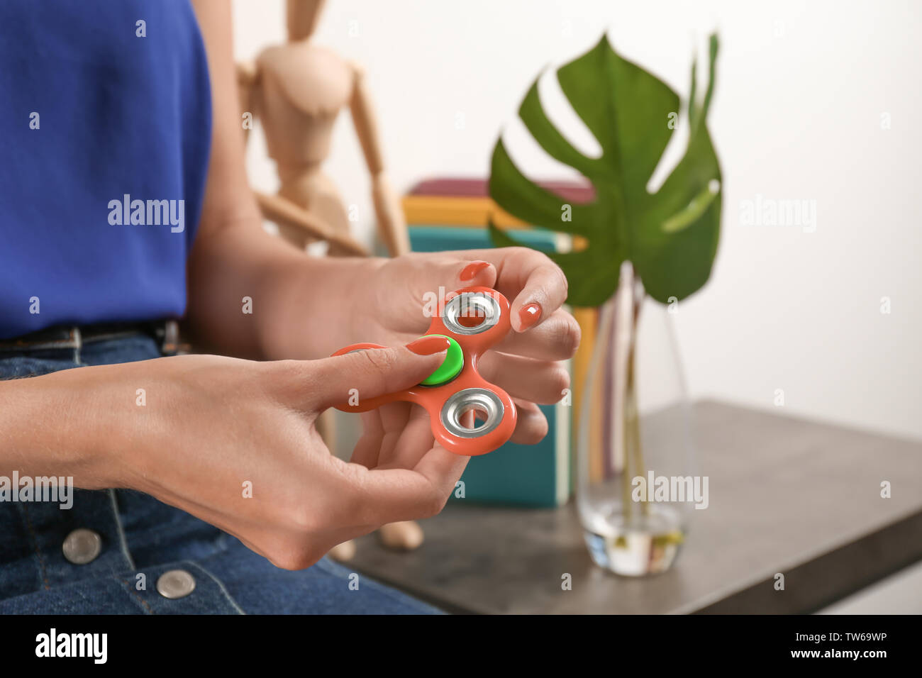 Woman rolling modern spinner indoors Stock Photo - Alamy