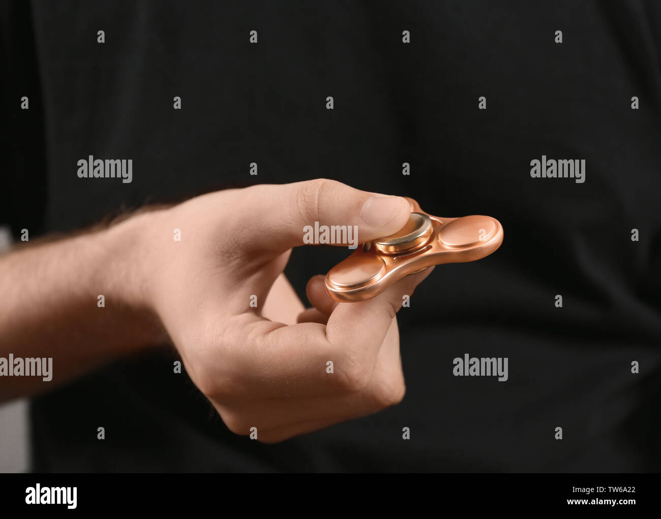 Man hand holding spinner hi-res stock photography and images - Alamy