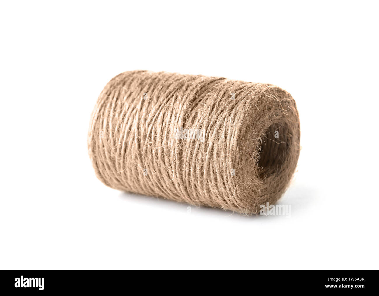 Spool of hemp rope on white background Stock Photo - Alamy