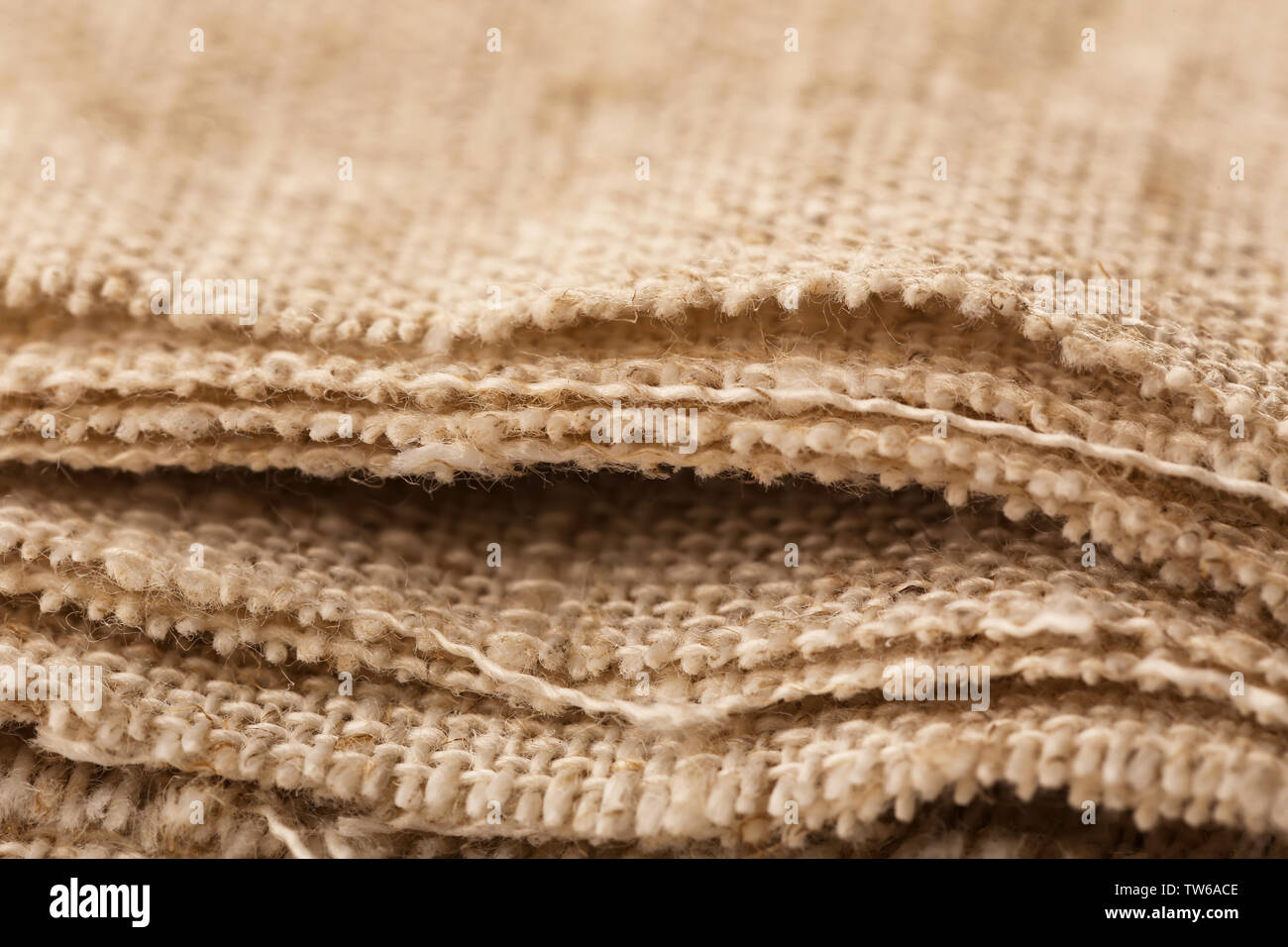 Folded hemp cloth texture, closeup Stock Photo - Alamy