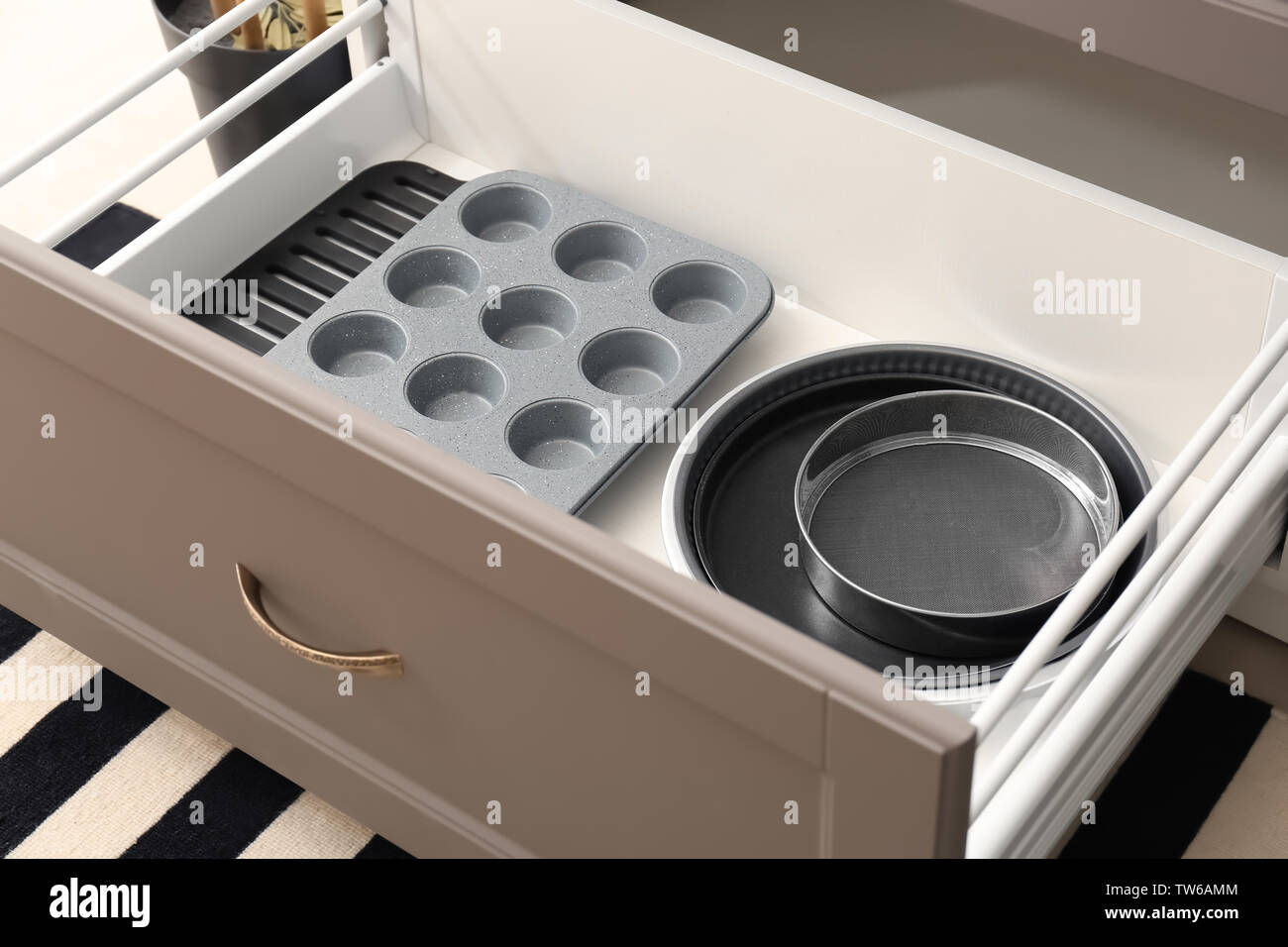 Set of kitchenware in drawer indoors Stock Photo - Alamy