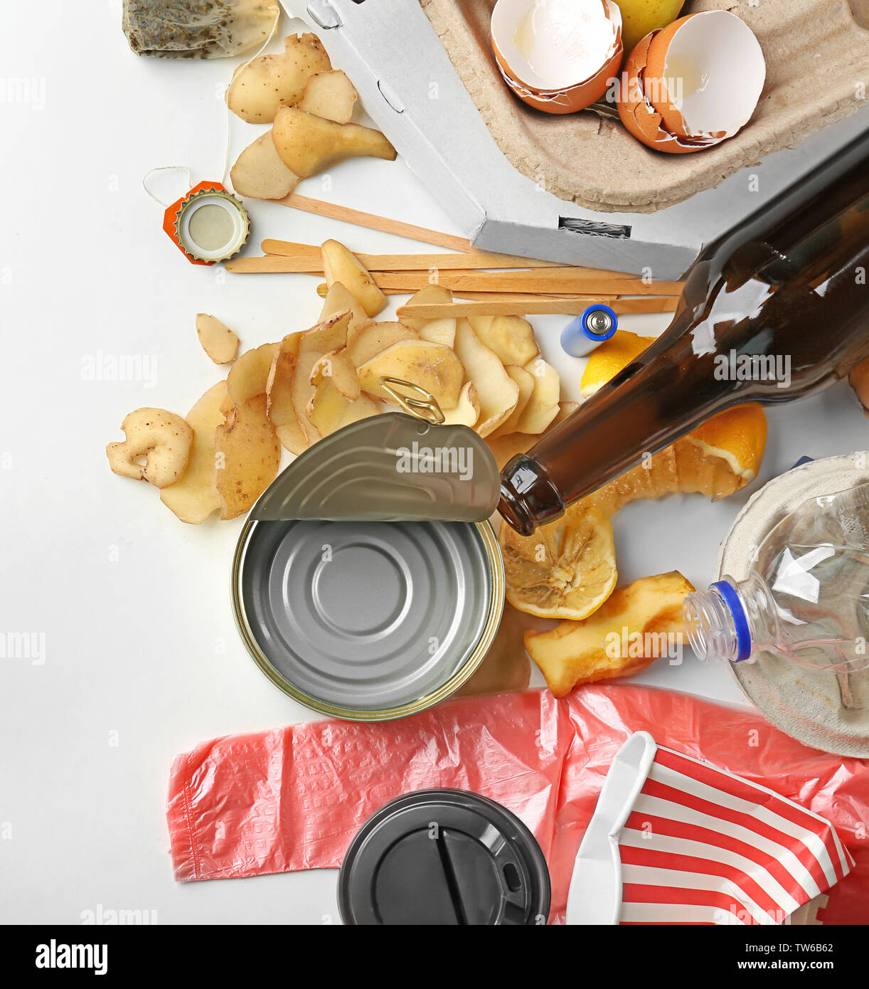 Composition with garbage on white background Stock Photo - Alamy