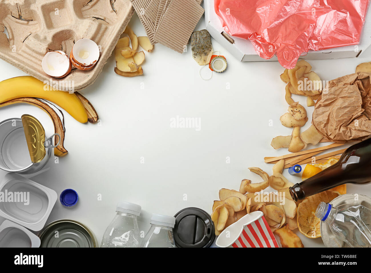 Composition with garbage on white background Stock Photo - Alamy