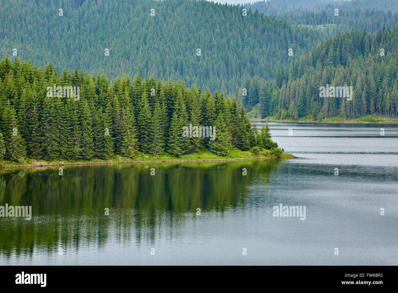 Beautiful valley between mountains rainy hi-res stock photography and ...