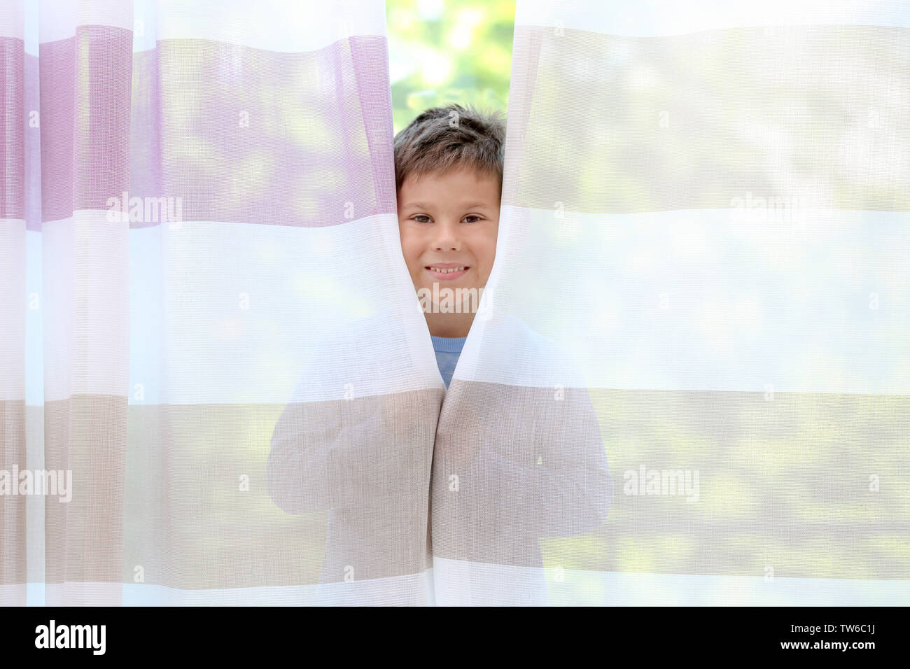 Hiding behind curtains hi-res stock photography and images - Alamy
